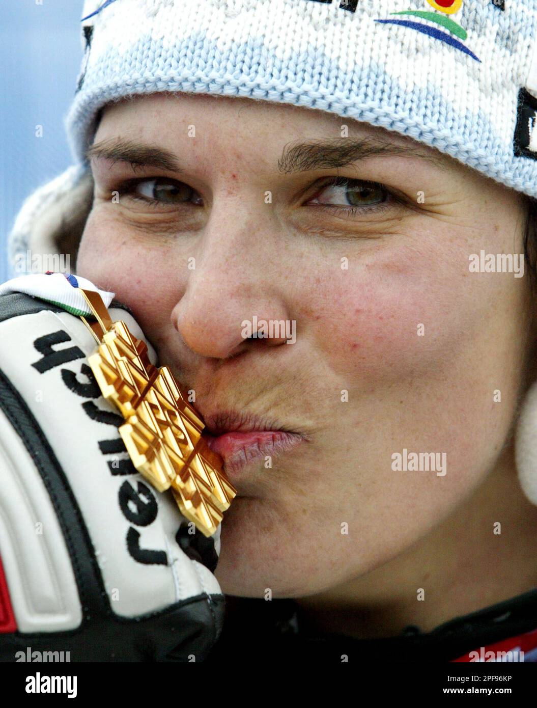 Austrian Michaela Dorfmeister kisses the gold medal she won in the ...
