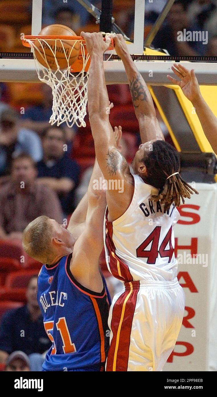 Miami Heat forward Brian Grant (44) dunks over New York Knicks center ...