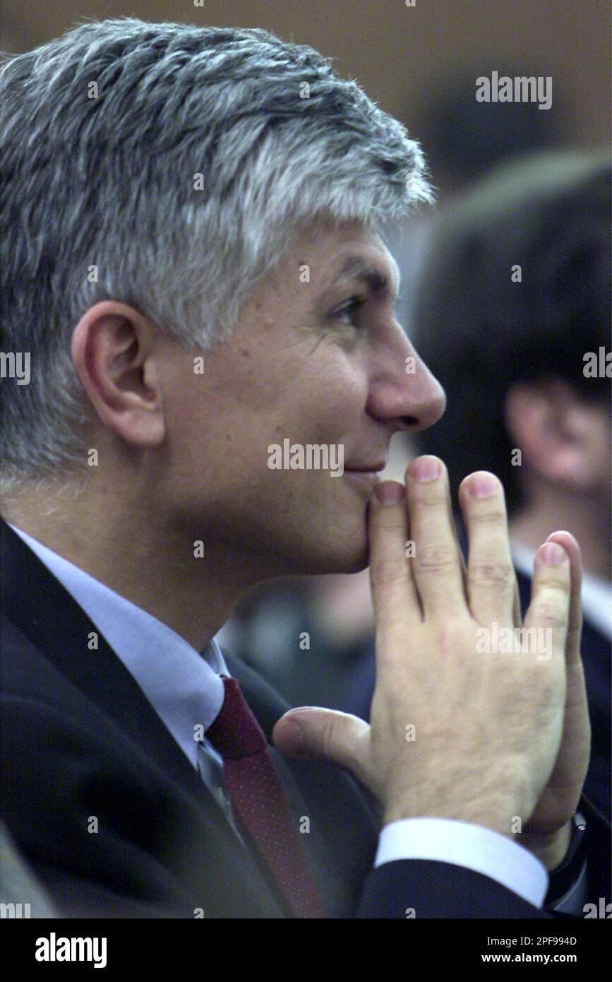 Serbia's Prime Minister Zoran Djindjic smiles as he listens to a debate ...