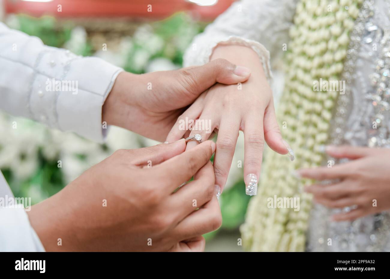 Closeup man putting engagement ring hi-res stock photography and images ...