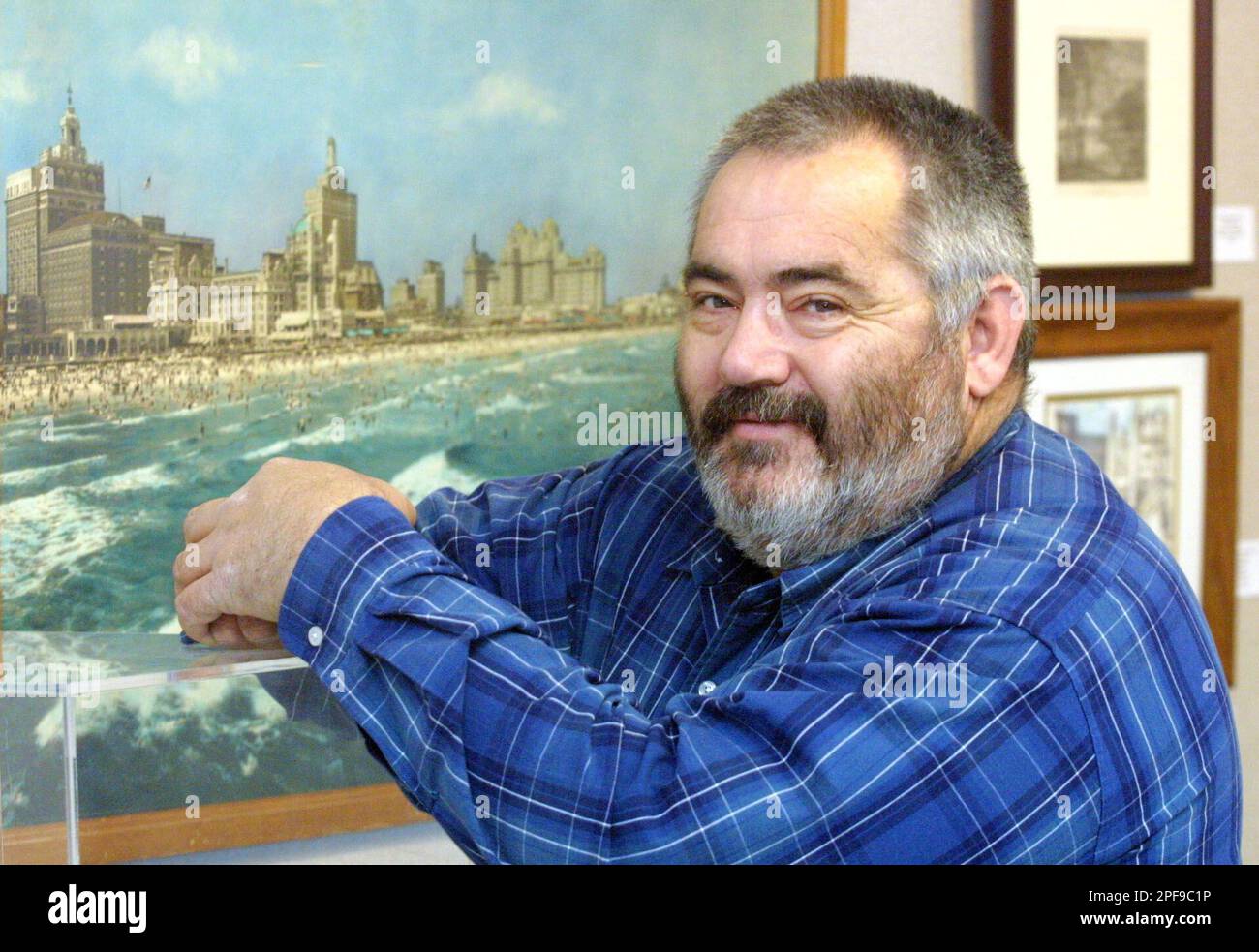 Atlantic City historian Robert Ruffolo stands next to a color ...
