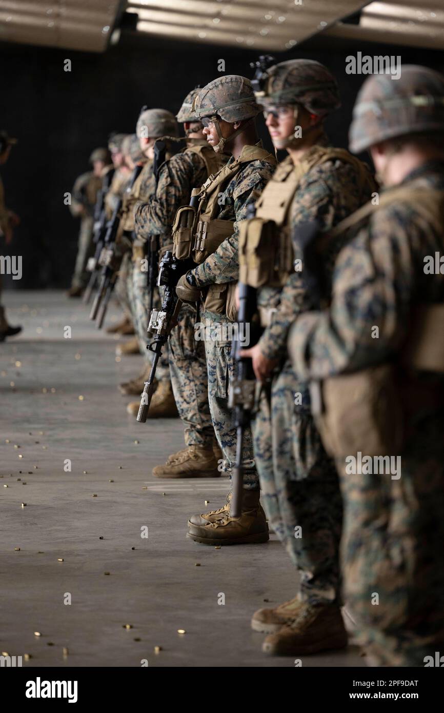 Marines with 1st Battalion, 8th Marines stand by on the firing line ...