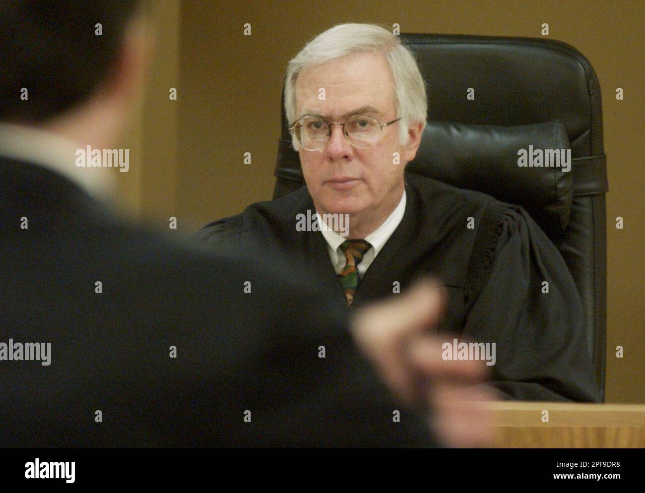 Pima County Superior Court Judge John F. Kelly listens to arguments ...