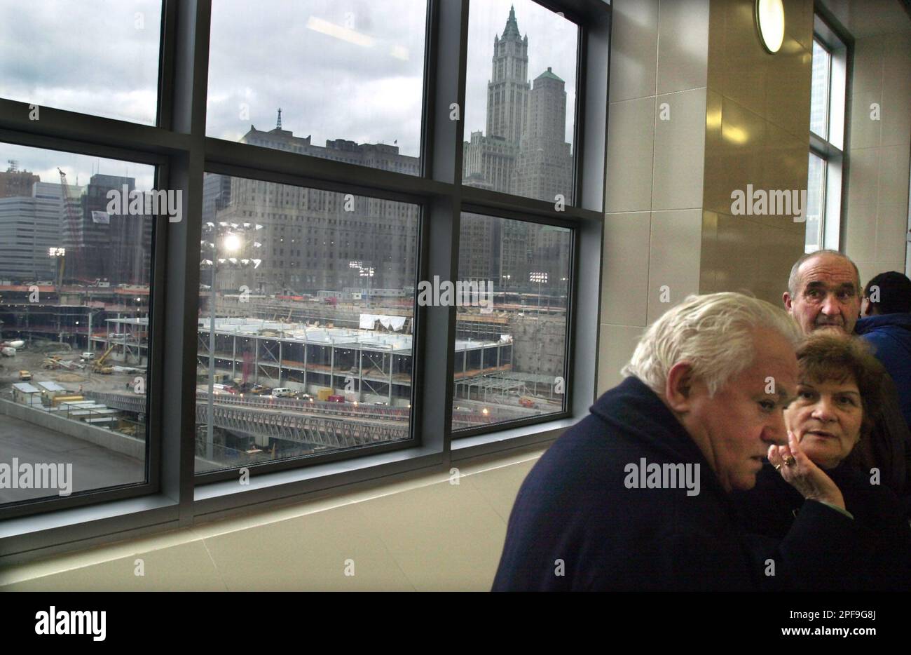 Viewers react after seeing the site of the World Trade Center from an ...