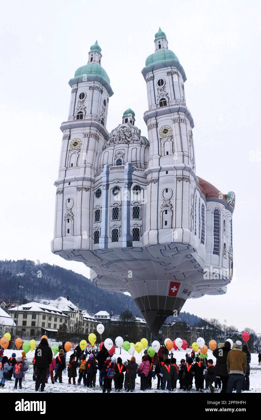 A hot-air balloon shaped as a cathedral is prepared for its first ...