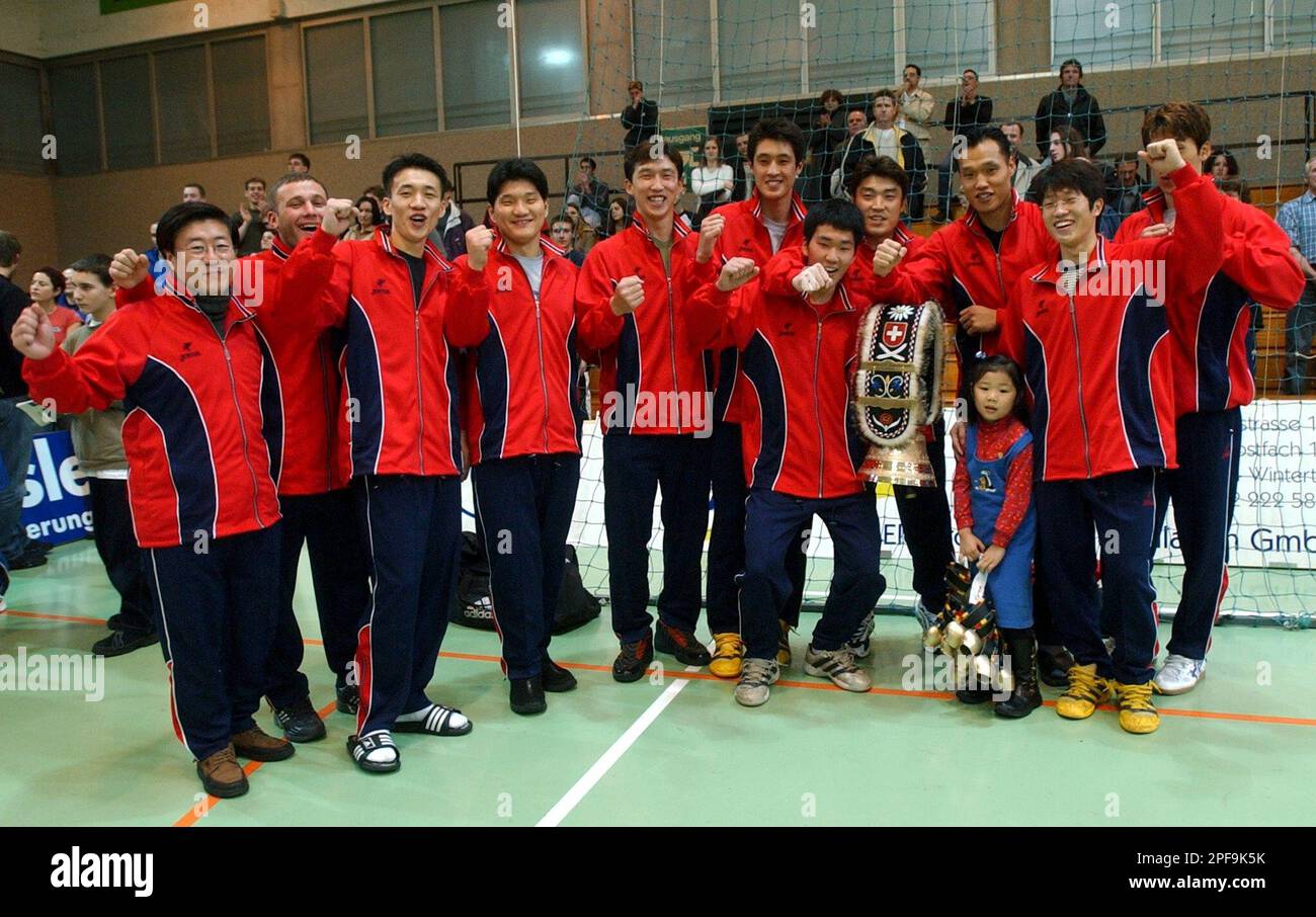 Captain Chi-Hyo Cho, 3rd from right, and the Korean handball team celebrate the winning of the ...