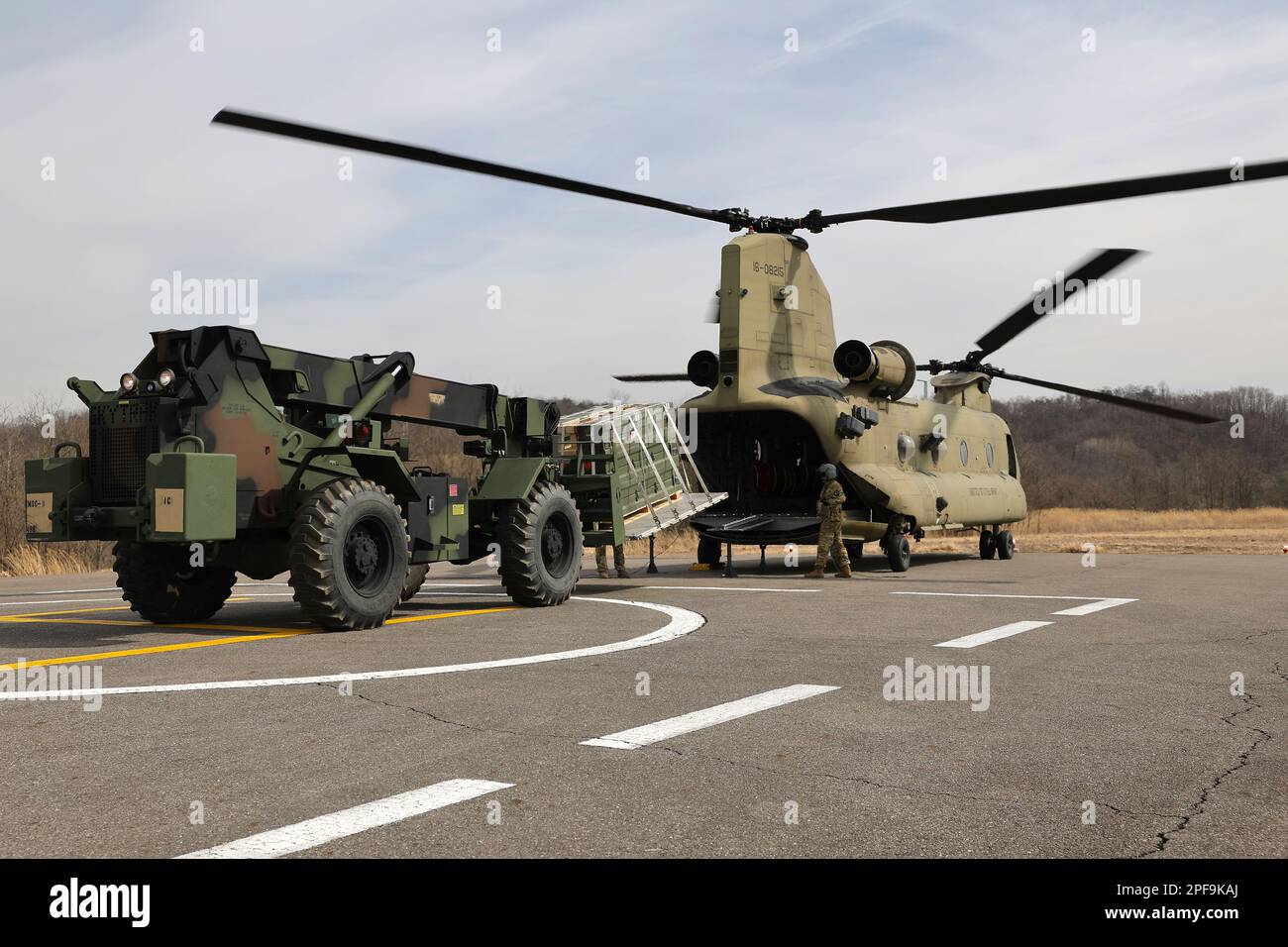 An All-Terrain Lifter Army System (ATLAS) loads AGM-114 Hellfire ...