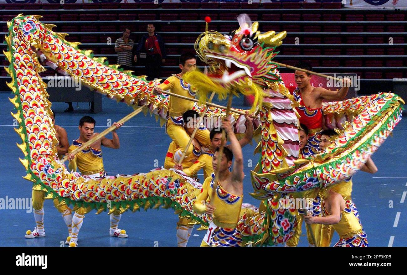 China's dragon dance team performs during the World Dragon and Lion ...