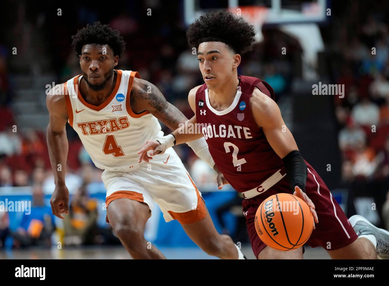 Colgate guard Braeden Smith (2) drives past Texas guard Tyrese Hunter ...