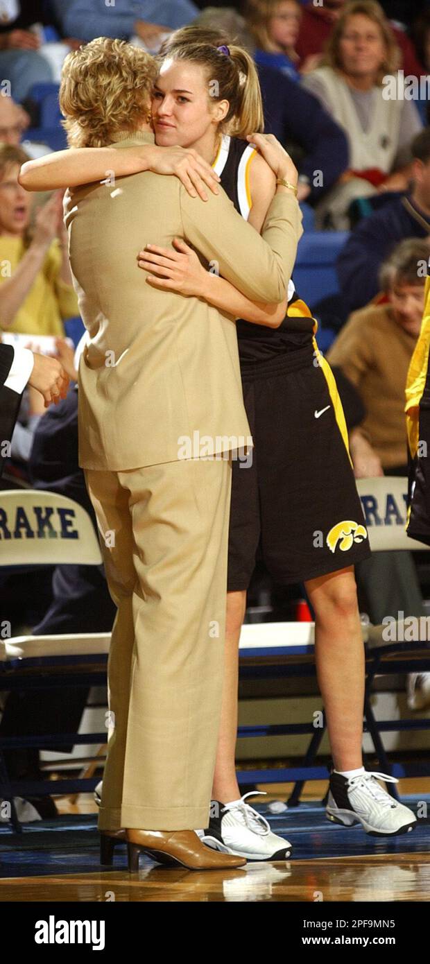 Iowa's Jennie Lillis, right, hugs coach Lisa Bluder, left, after Iowa's ...