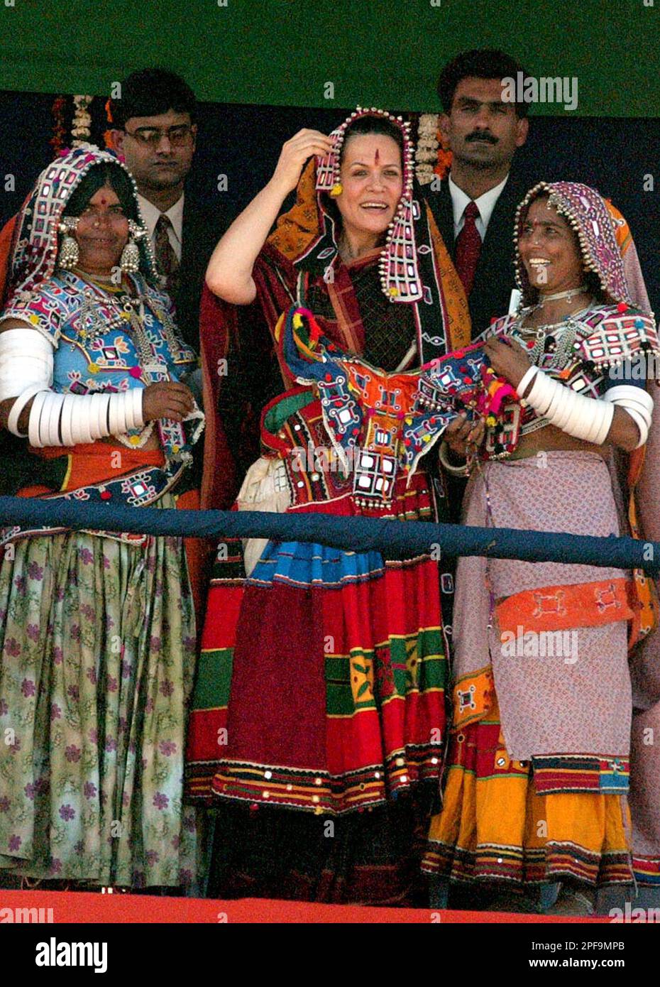 Indian Congress leader Sonia Gandhi, center, wearing a tribal Lambada ...