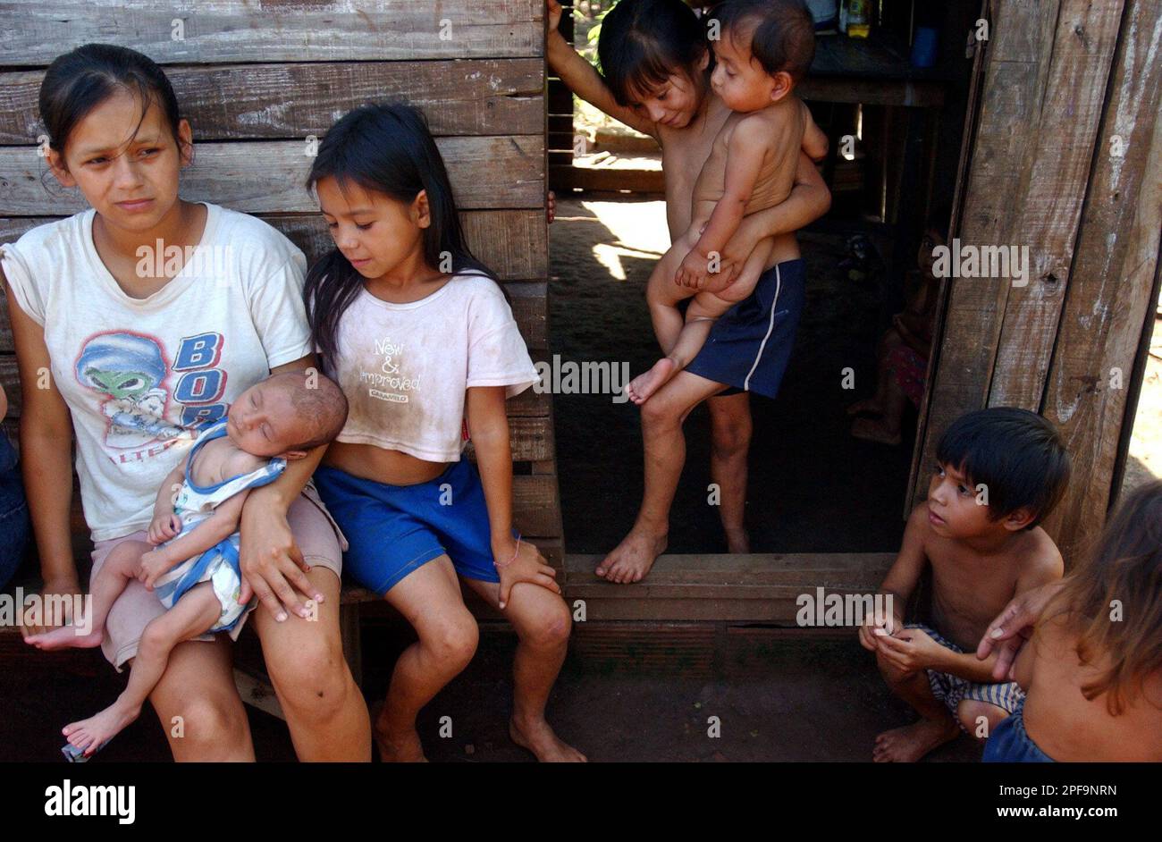 Celia Contreras,15, left, holds her two-month-old son Wilson, while her ...