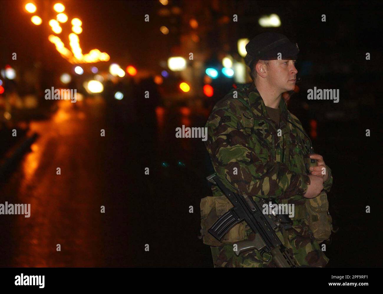 British peacekeeper secures the area around the place were the a car ...