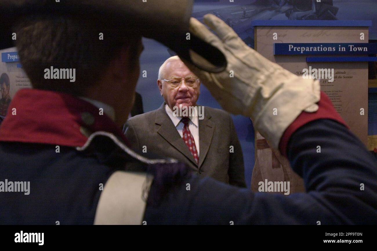 Illinois Gov. George Ryan, center, receives a hand salute from Capt ...