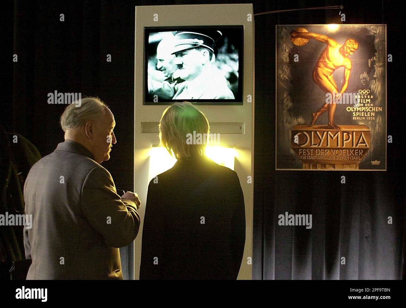 Visitors watch film scenes on a screen showing German late dictator ...