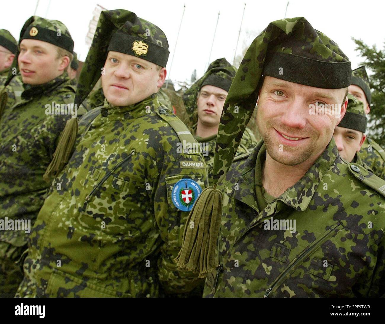 A detachement of Danish KFOR soldiers stand on parade at Camp Olaf Rye ...