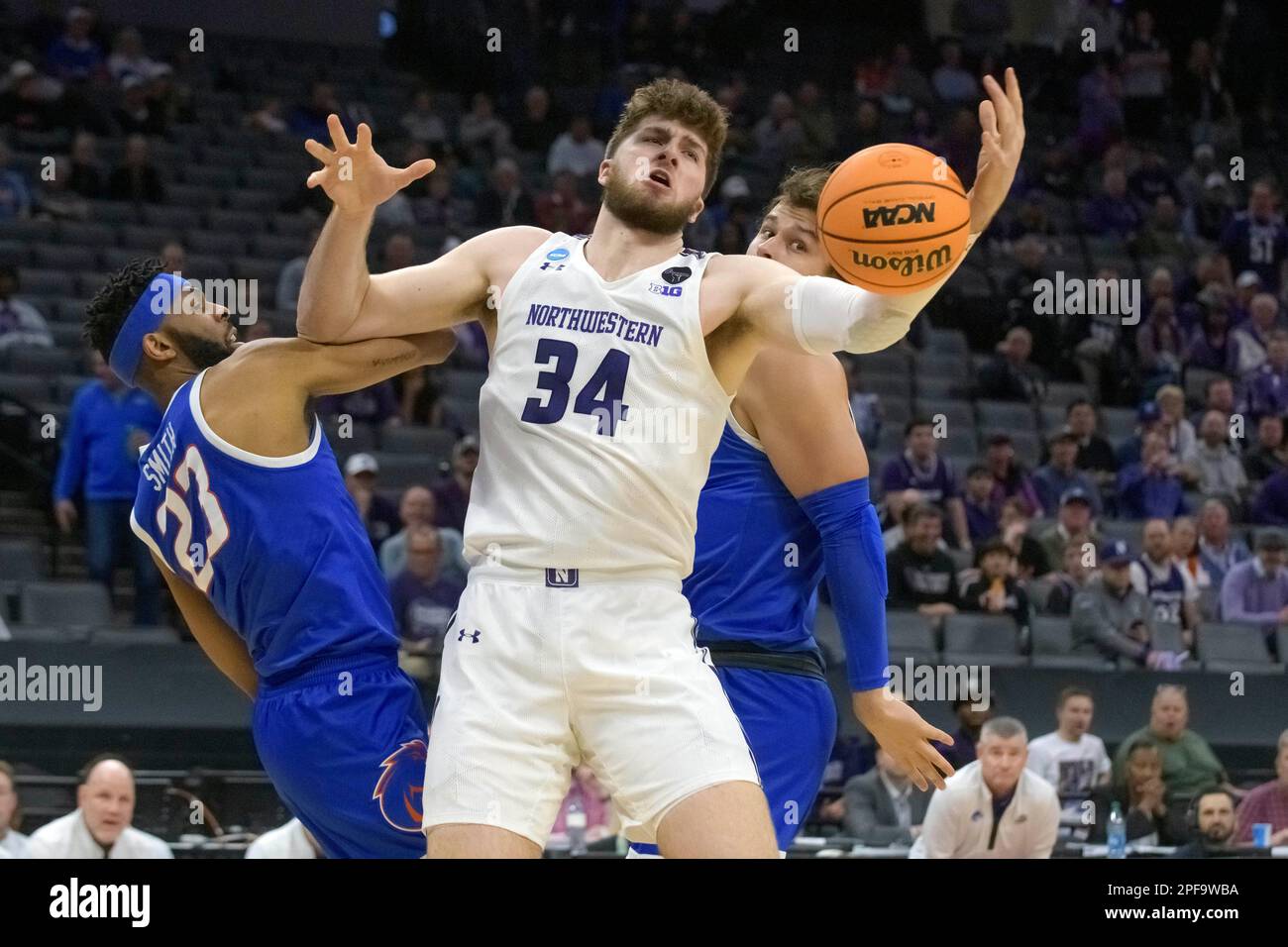 Northwestern center Matthew Nicholson (34) is guarded by Boise State ...