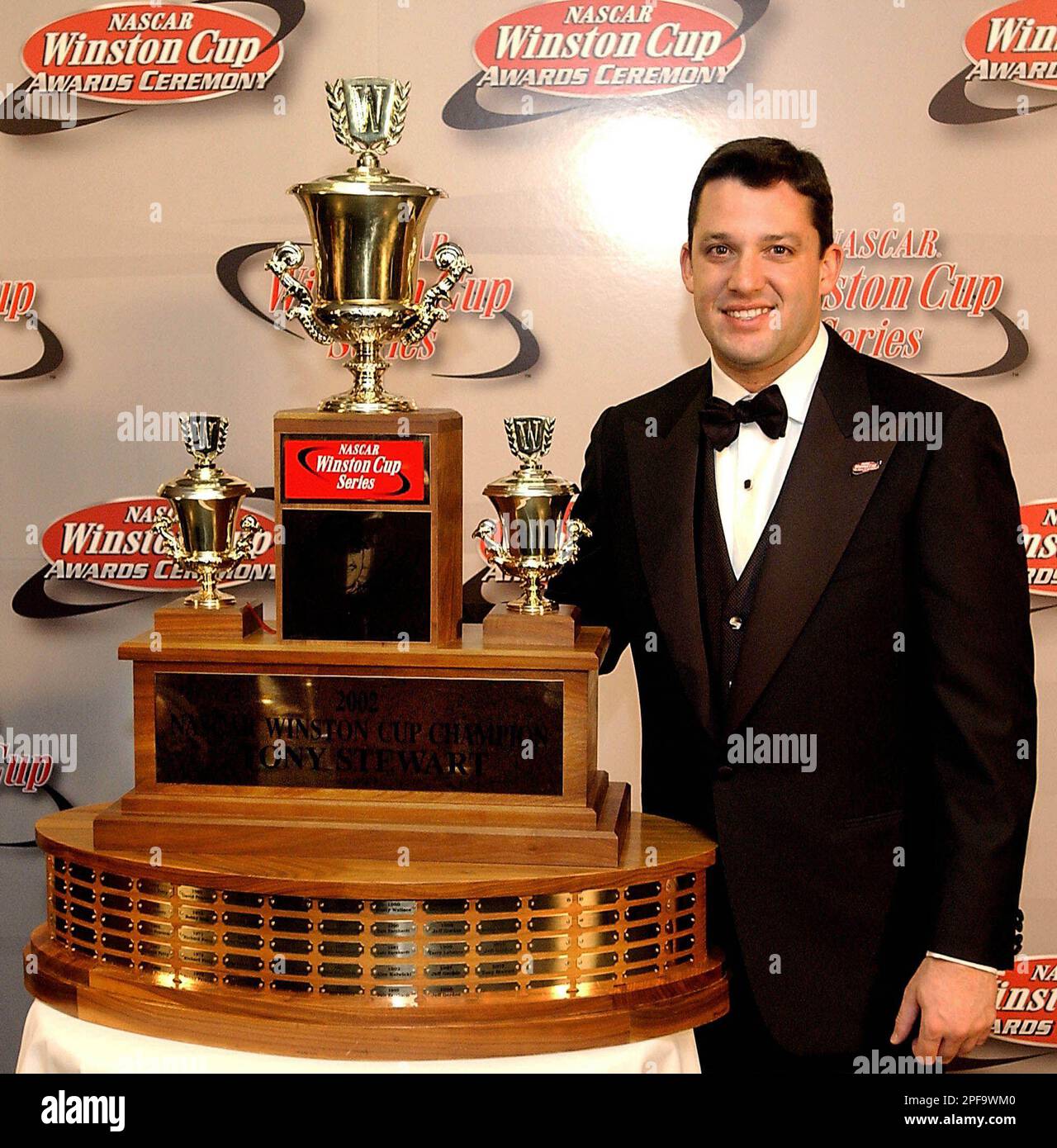 Nascar Winston Cup champion Tony Stewart poses with the Championship ...