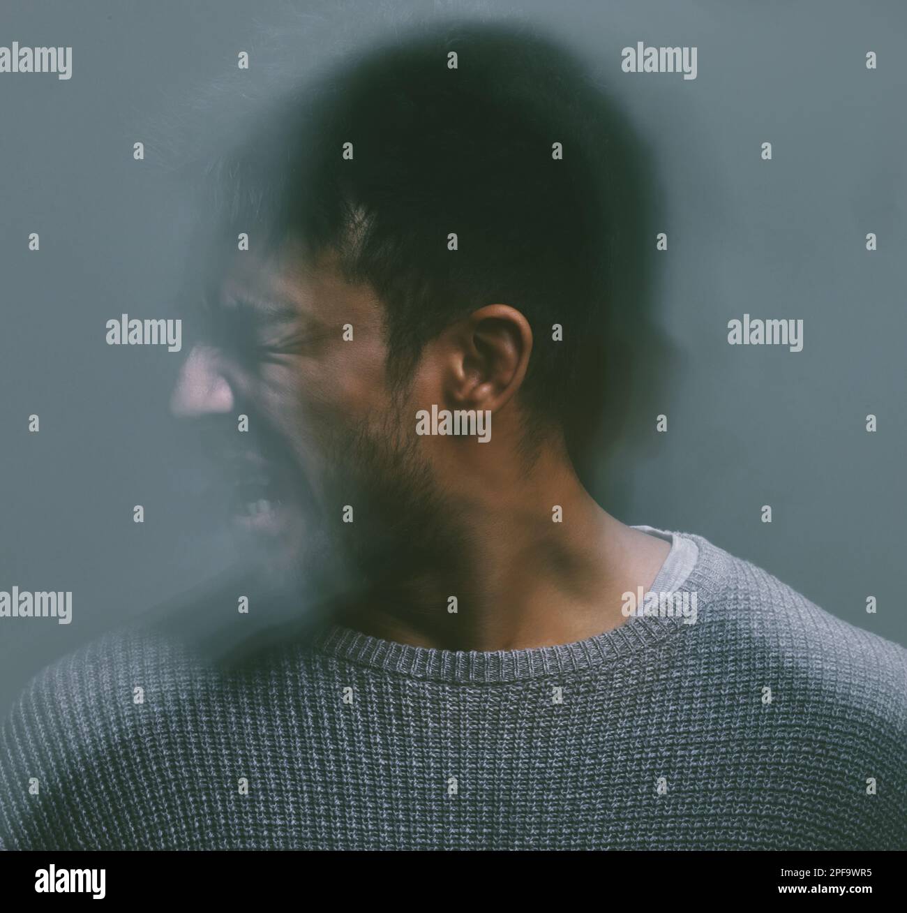 Everyone has a dark side. Studio shot of a young man experiencing ...