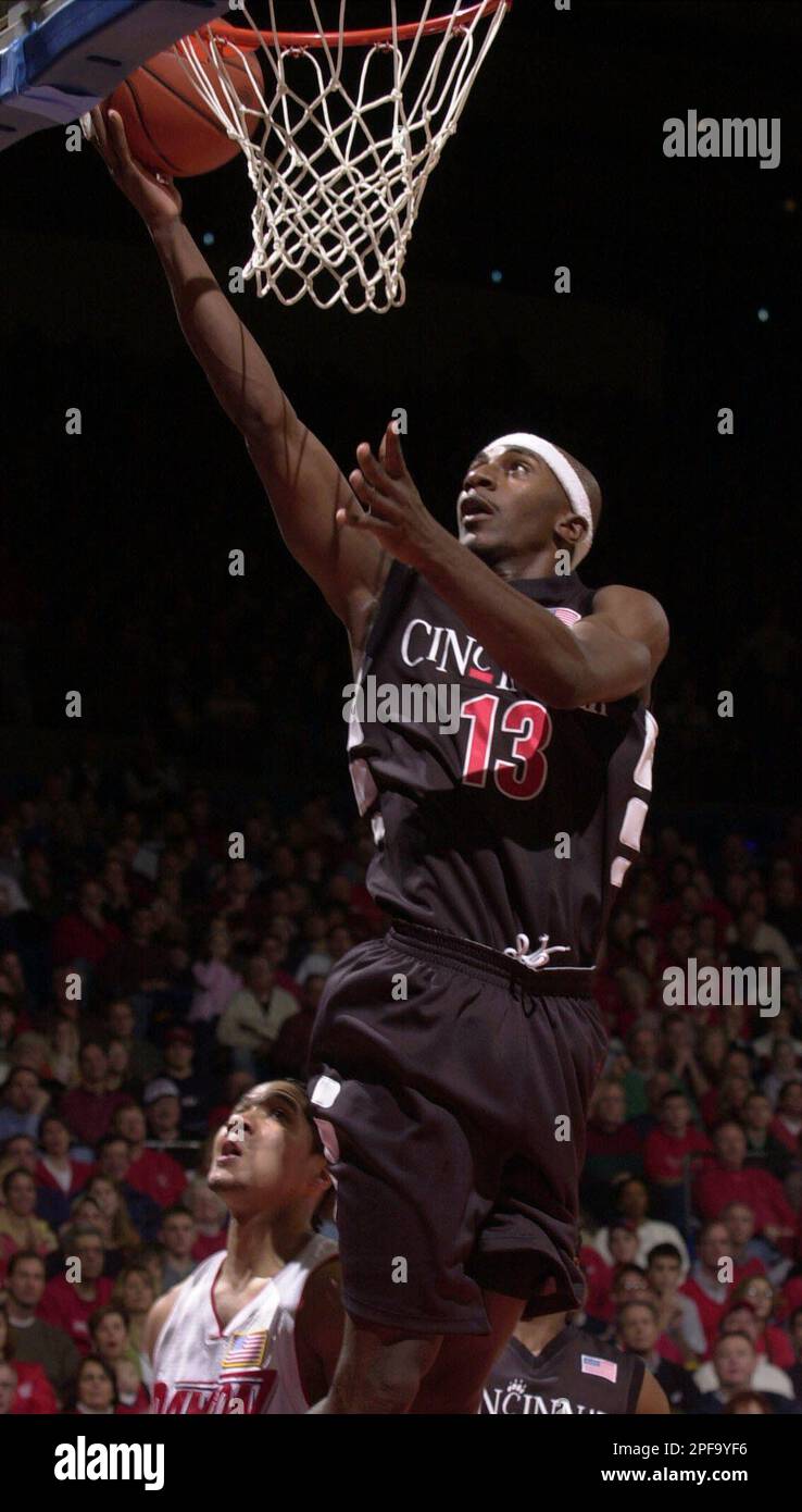Cincinnati forward Leonard Stokes (13) goes up for a layup over Dayton ...