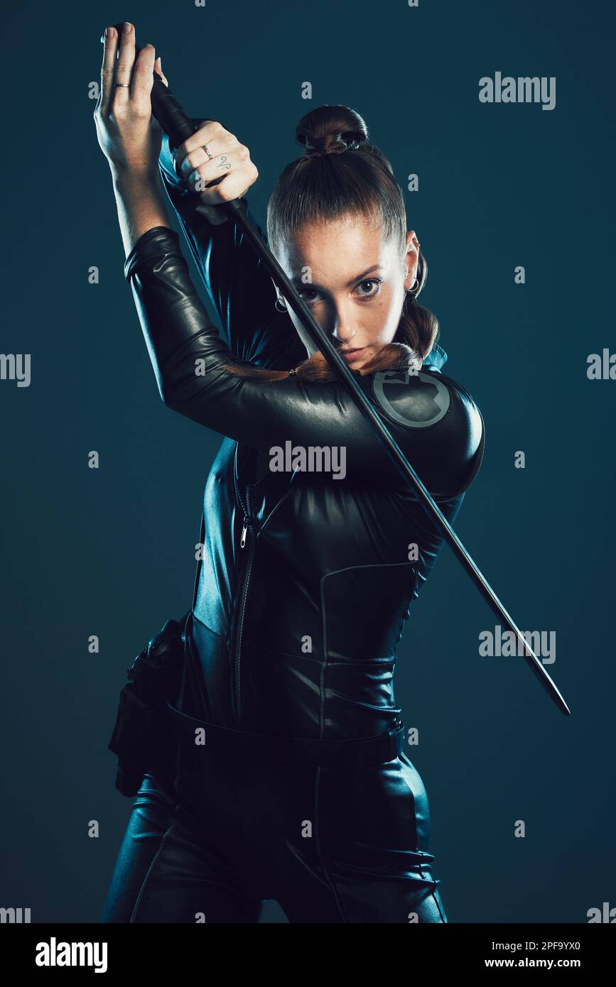 Woman, warrior and vigilante in cosplay with sword for dangerous battle ...