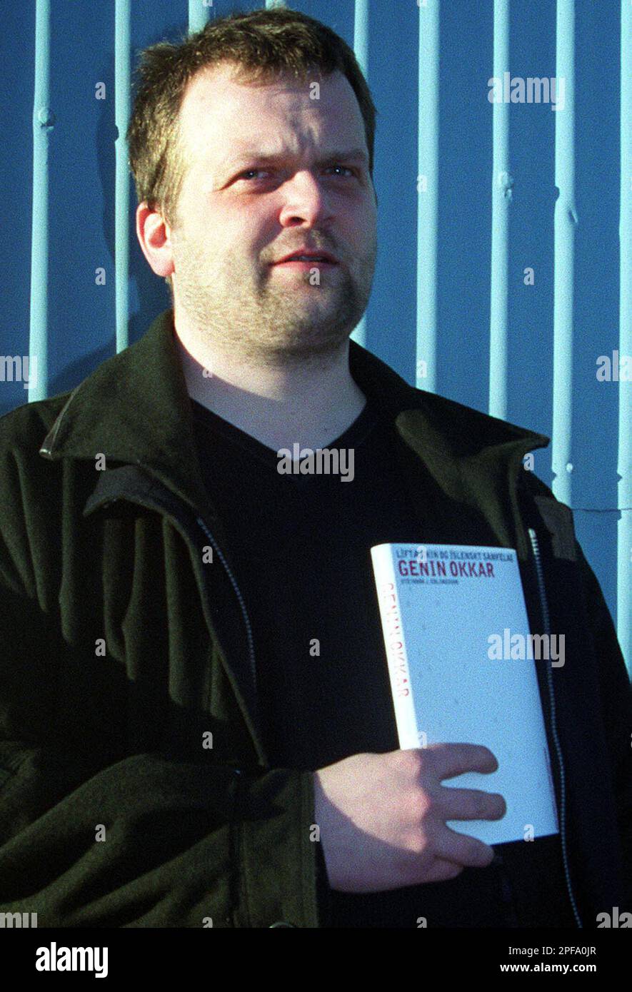 Steindor Erlingsson holds a copy of his book "Our Genes" in Reykjavik ...