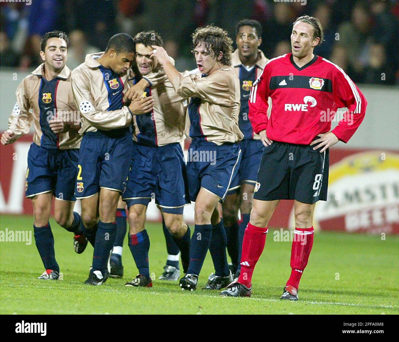 Barcelona's Marc Overmars, center, of Netherlands celebrates with ...