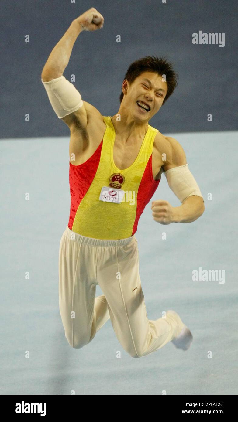 Chinese Xiao-Peng Li reacts after his performance in the parallel bars ...