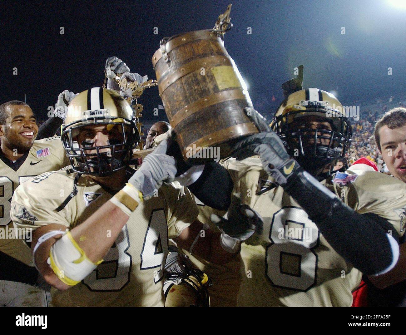 Purdue linebacker Niko Koutouvides, left, and safety Ralph Turner hold ...