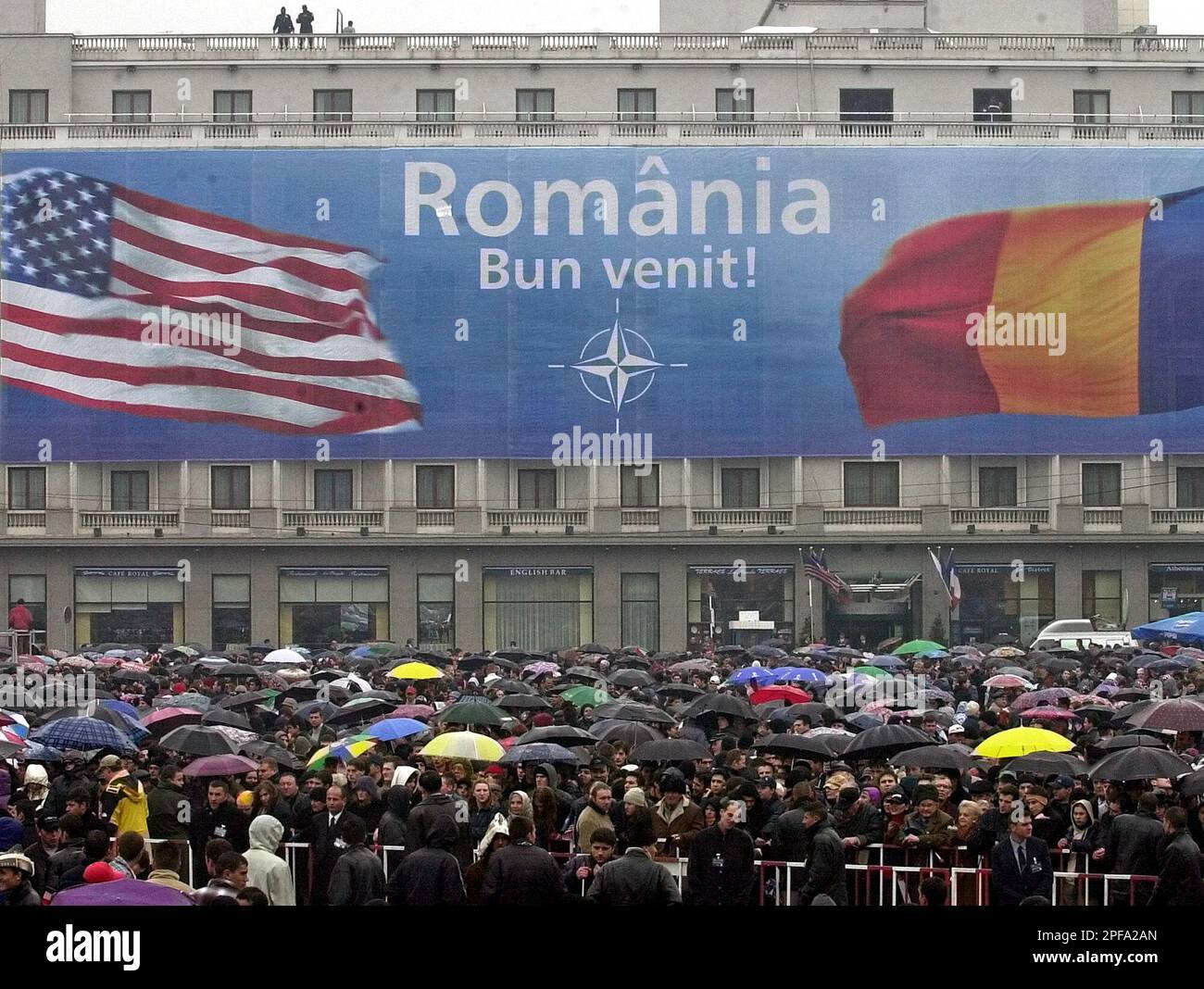 Under the eyes of anti-terrorist sharp shooters,and a sign reading ...