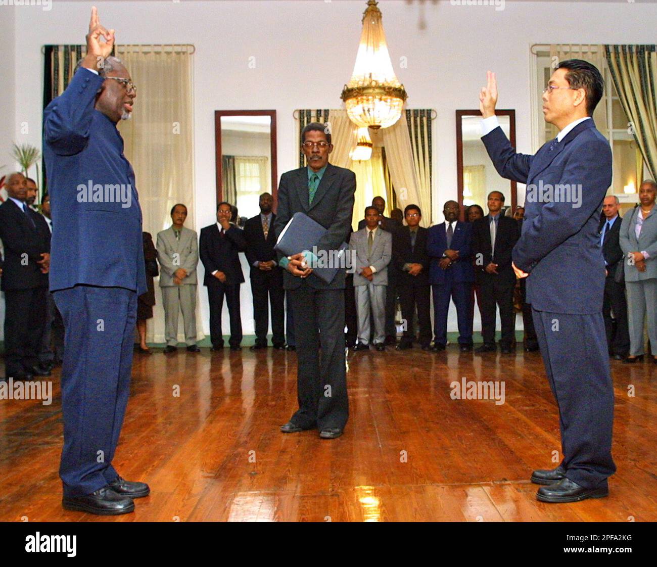 President Ronald Venetiaan, administrates the oath of Michael Pierre ...