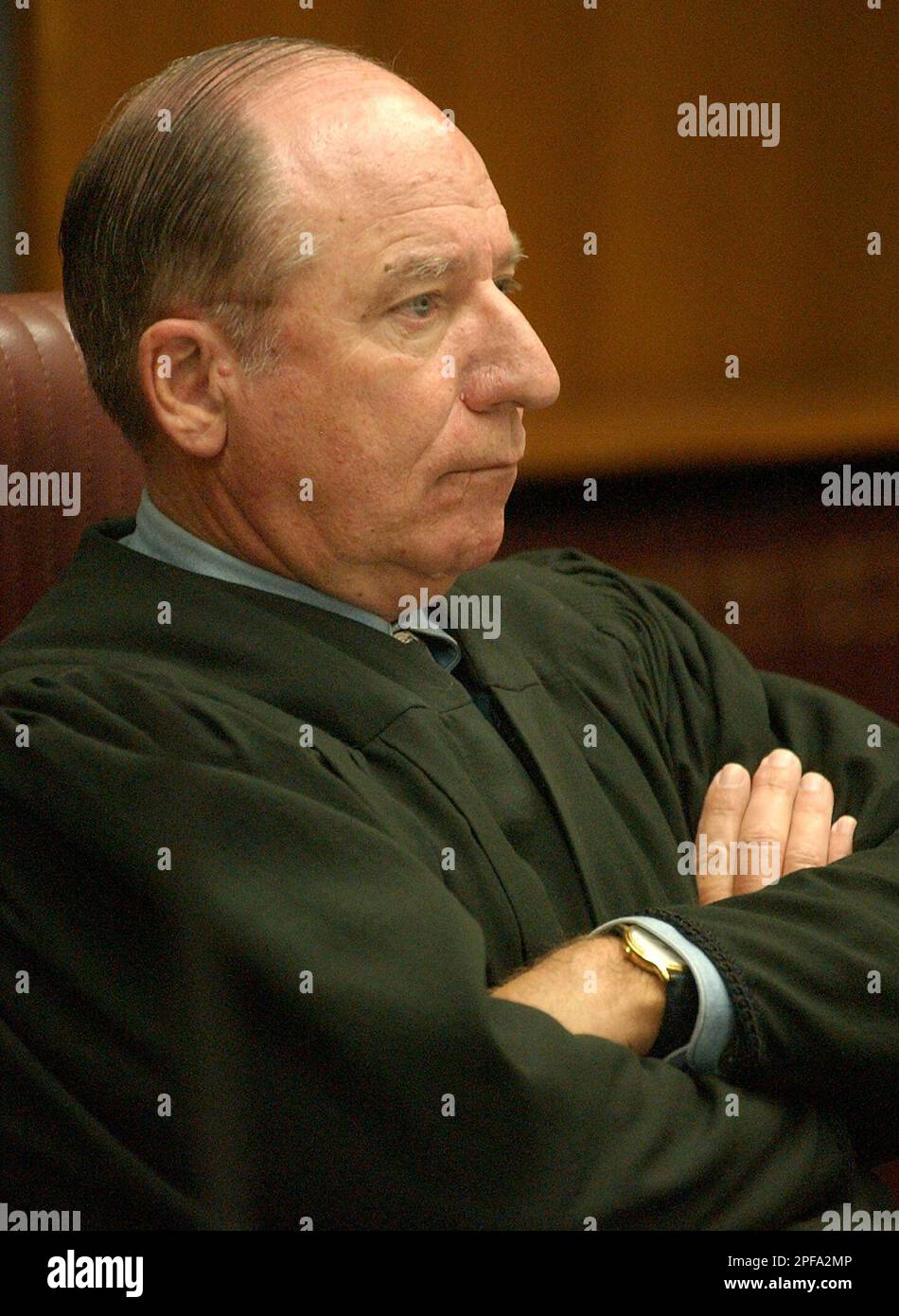 Judge William Mudd listens to a motion for a delay in the sentencing of ...