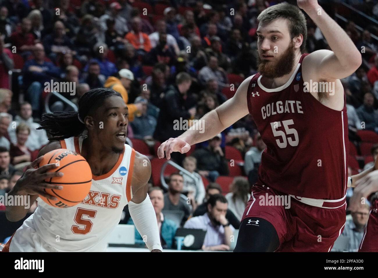 Texas's Marcus Carr tries to get past Colgate's Jeff Woodward during ...