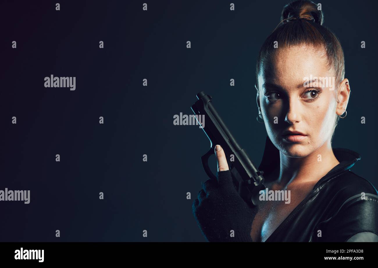 Woman, vigilante and gun in serious war, battle or agent standing ready ...