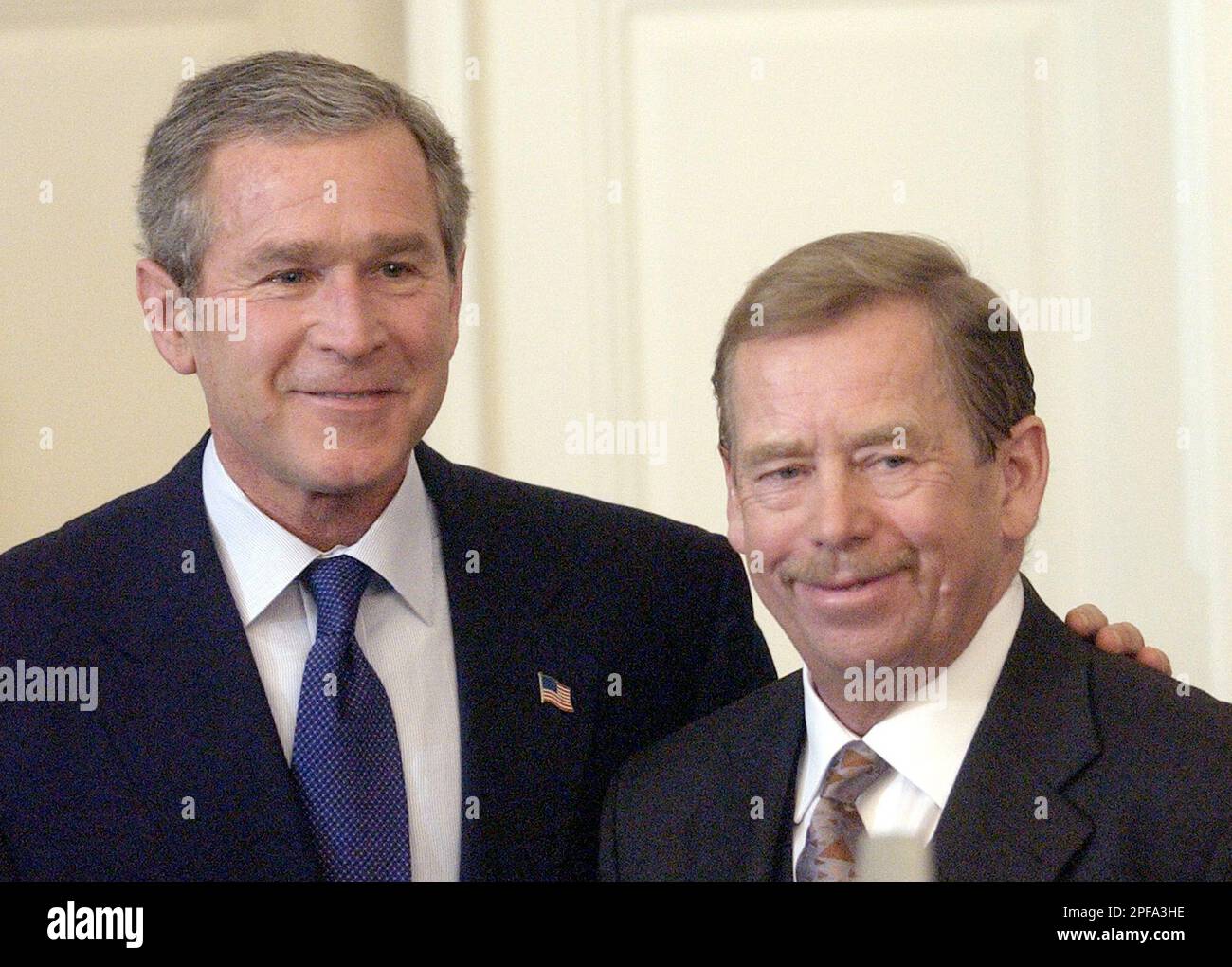U.S. President George W. Bush, left, embraces his Czech counterpart ...