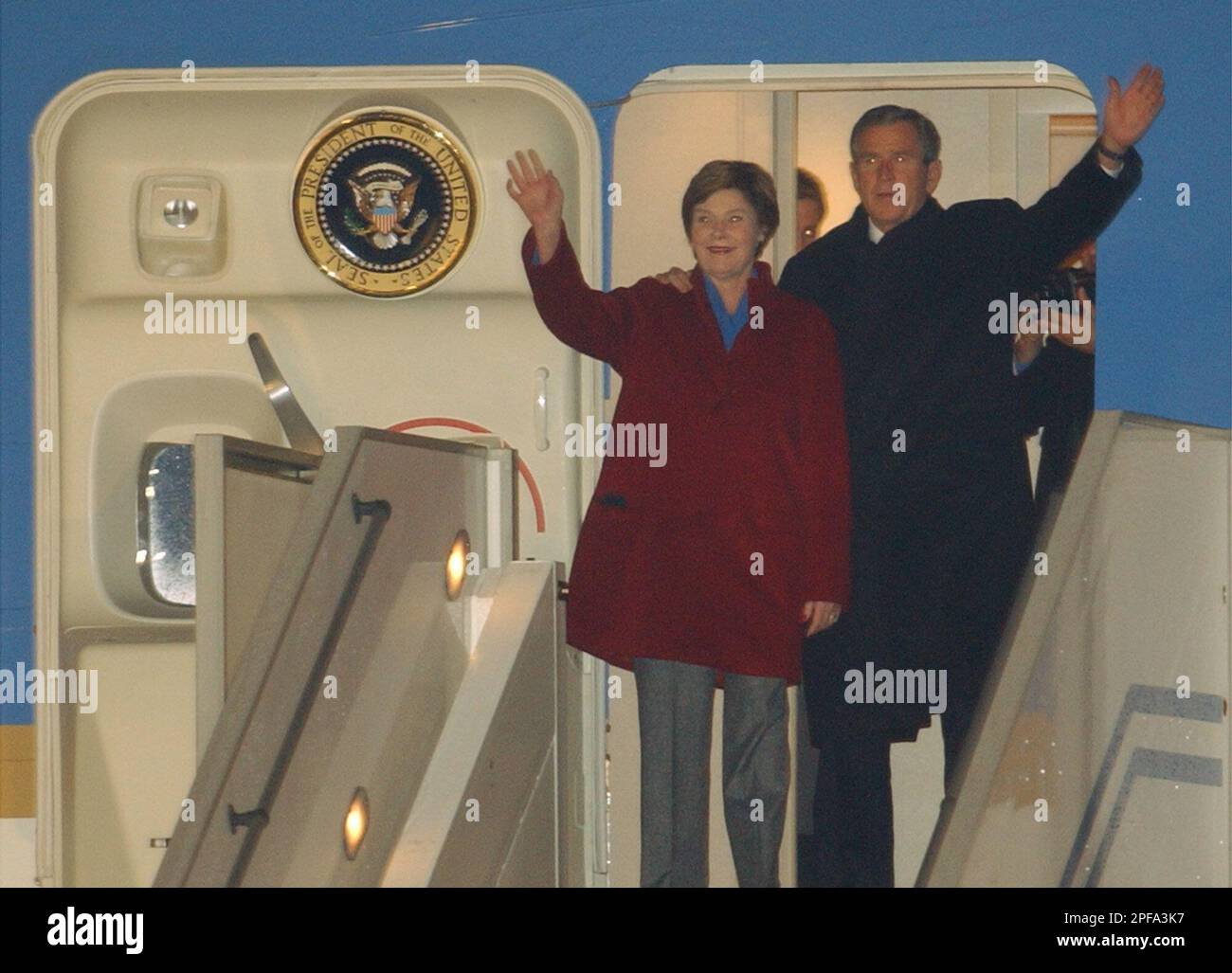 President George W. Bush and first lady Laura Bush wave after arriving ...
