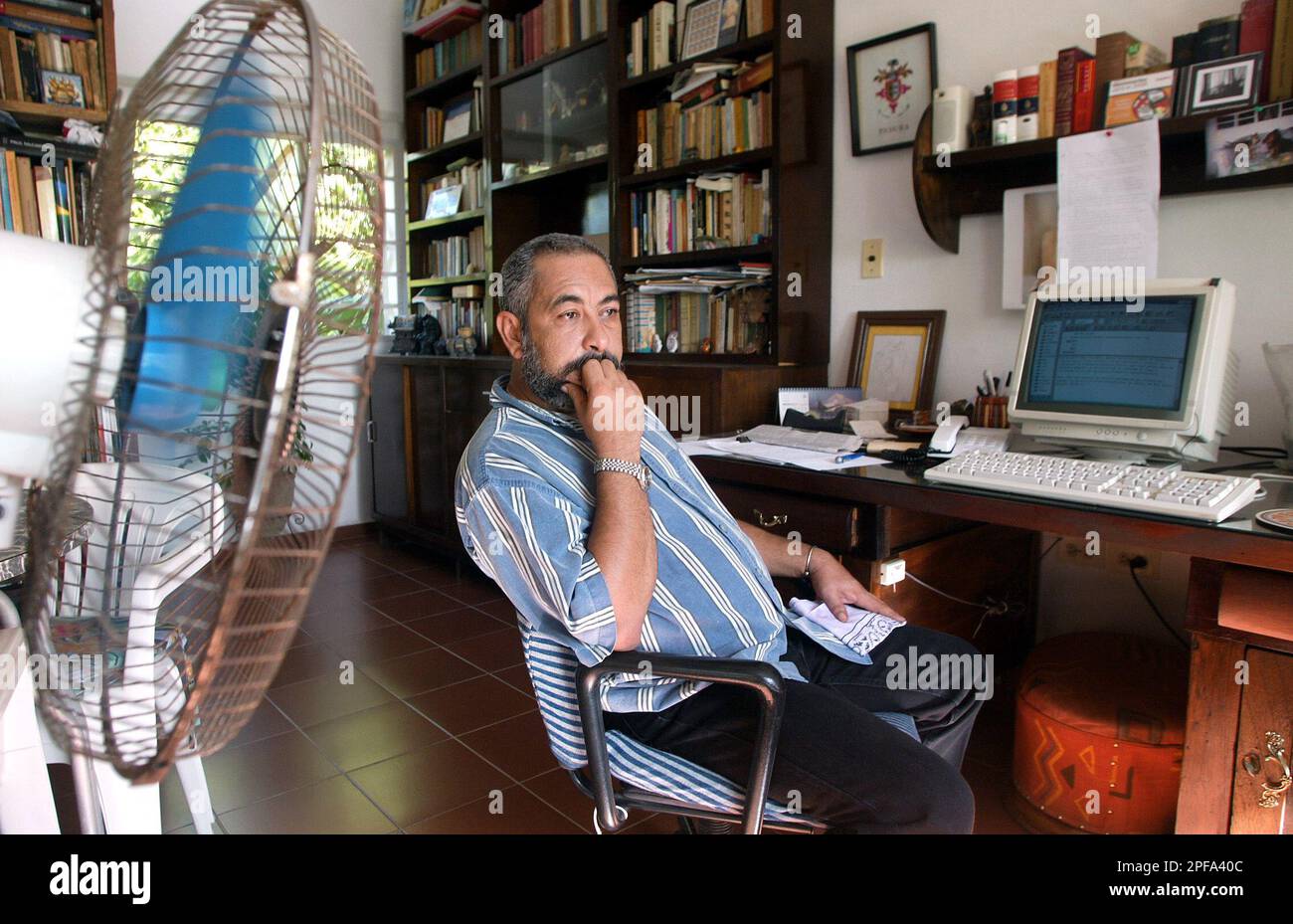 Cuban writer Leonardo Padura poses at his home in Havana, Cuba, Sept.17 ...