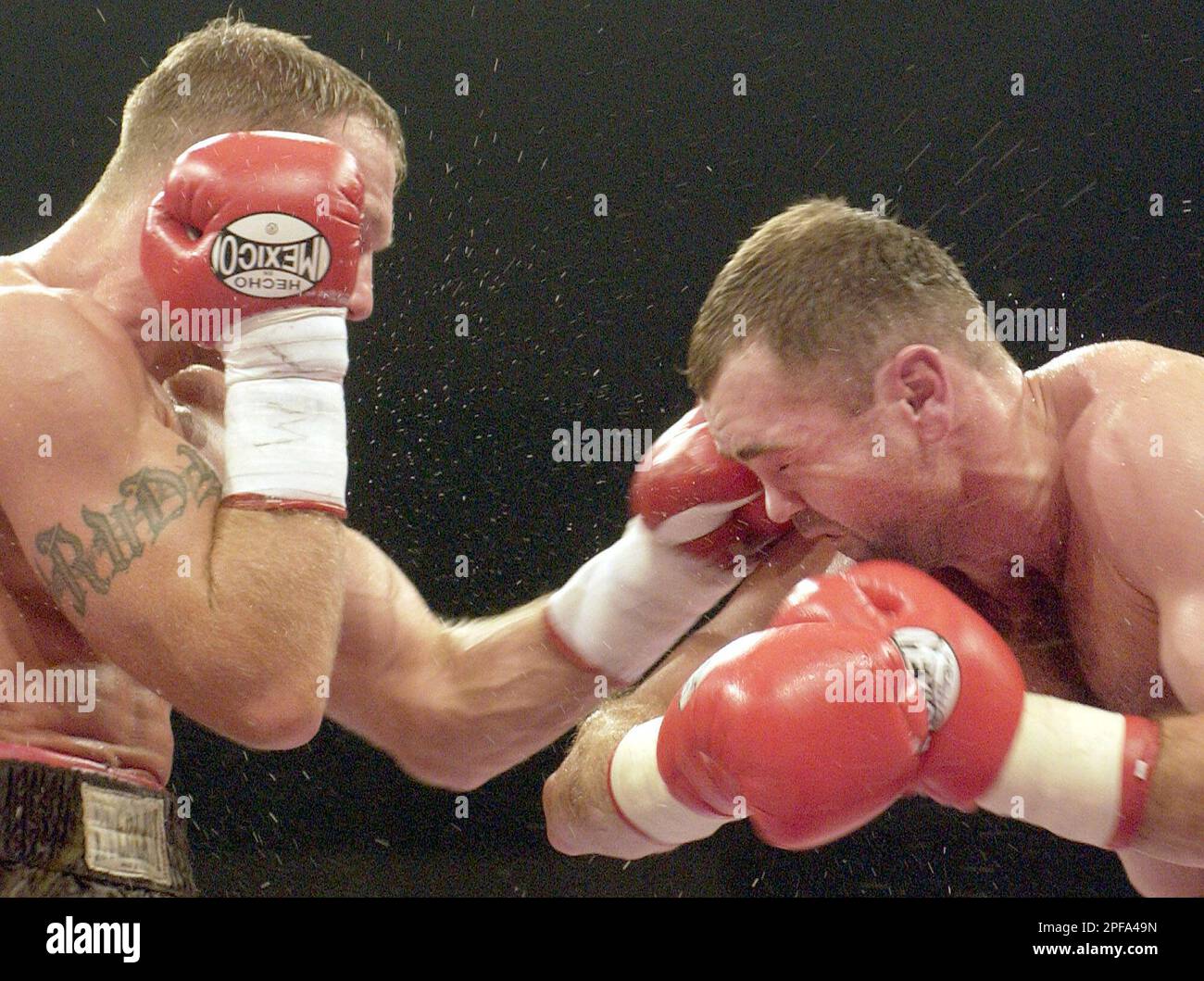 German boxer Sven Ottke, right, is punched by Rudy Markussen from ...