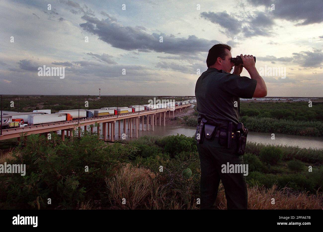 U.S. Border Patrol supervisor Dan Garibay scans the Rio Grande for ...