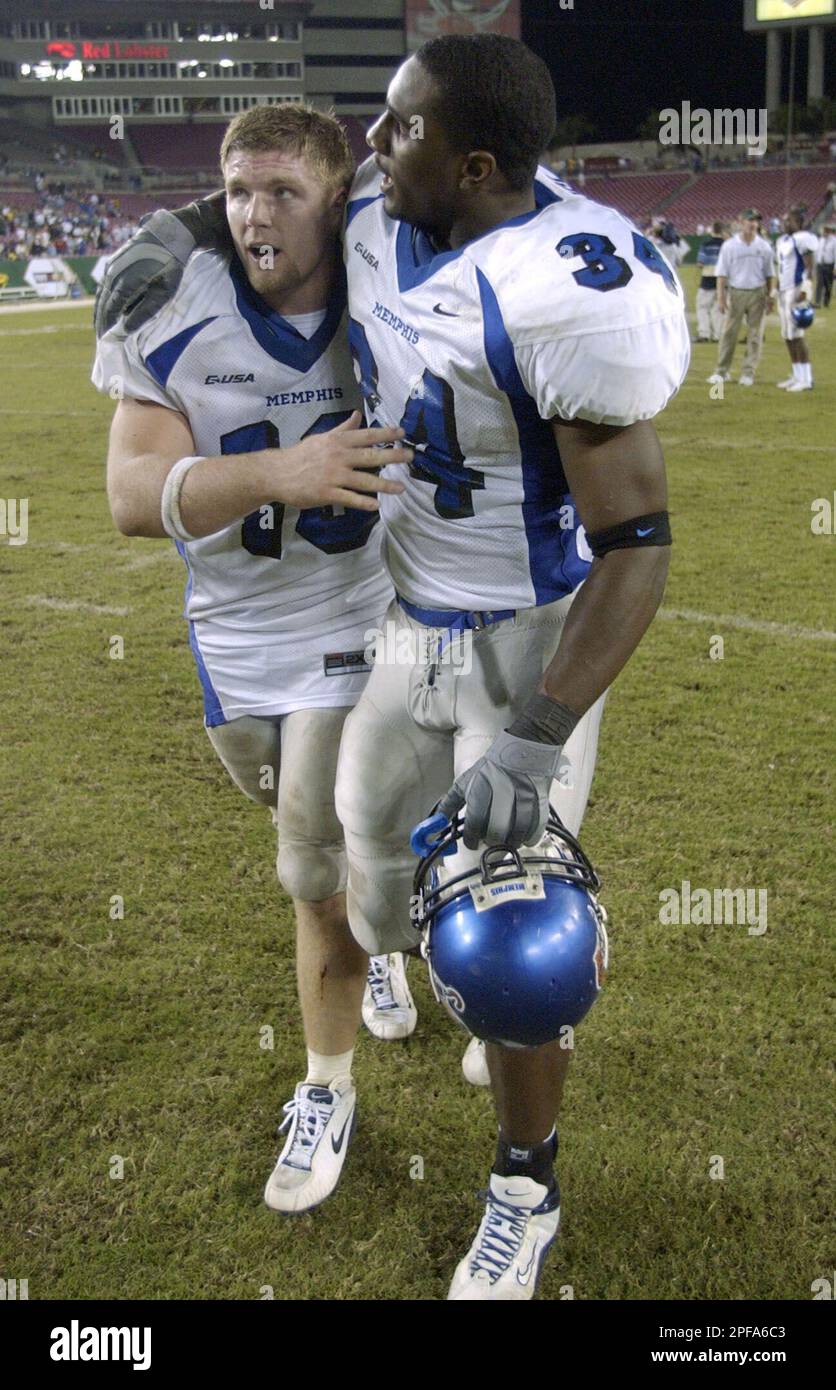 Memphis quarterback Danny Wimprine, left, and teammate Robert Douglas leave the field after ...