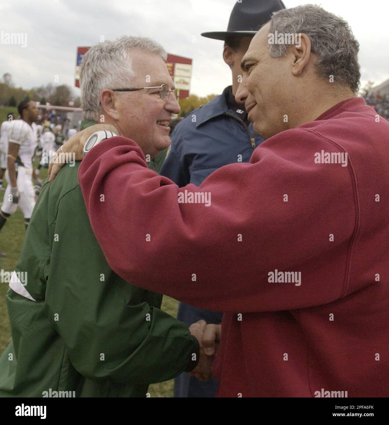 Michigan State interim coach Morris Watts, left, is congratulated on ...