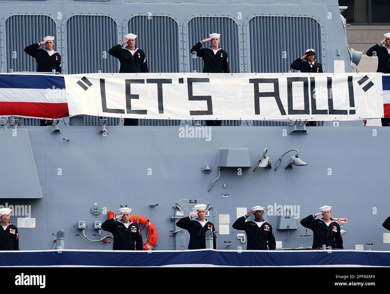 Sailors aboard the U.S. Navy's newest warship, the USS Preble, salute ...