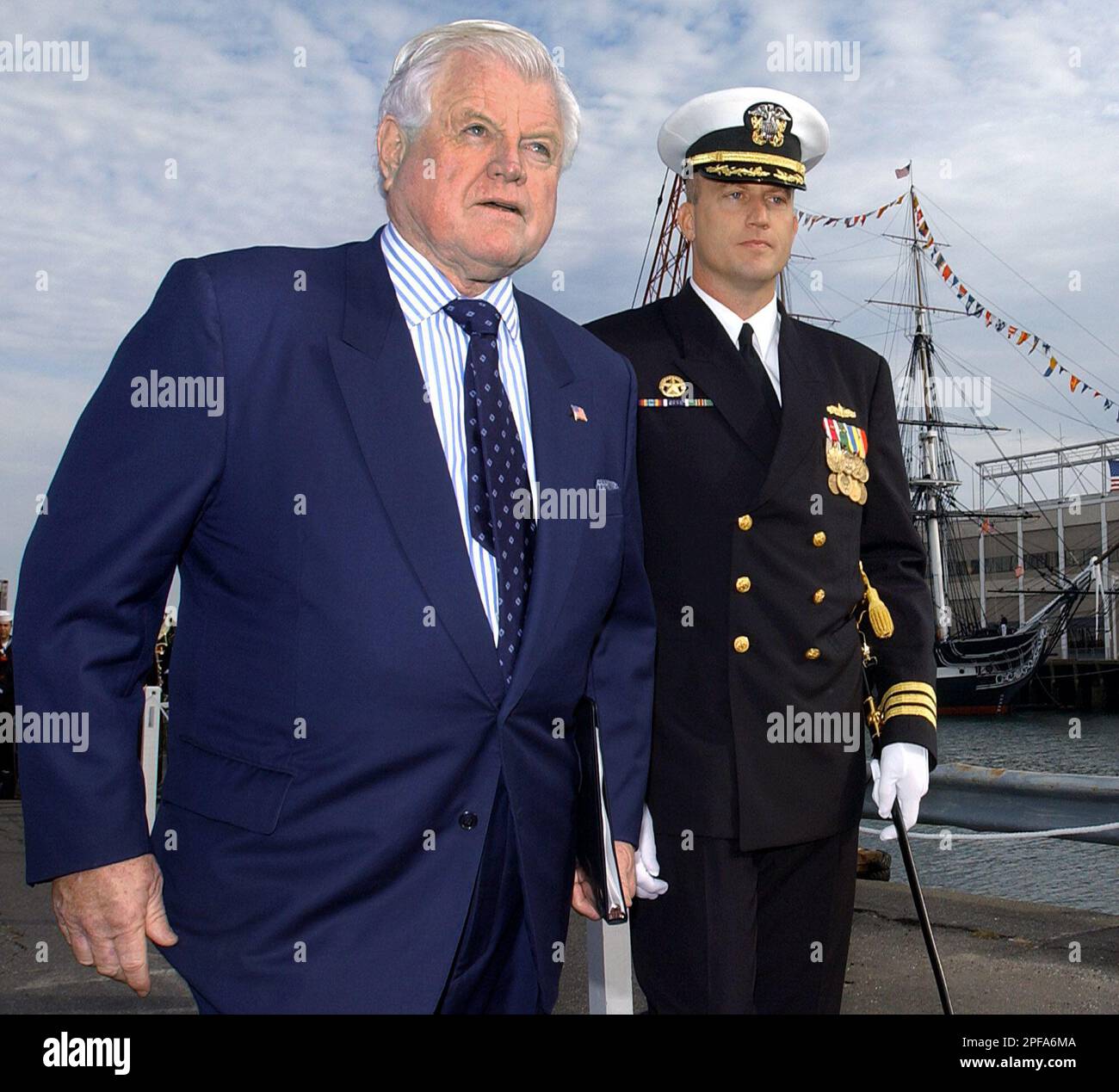 Sen. Edward Kennedy, D-Mass., left, is escorted by Commander Timothy ...