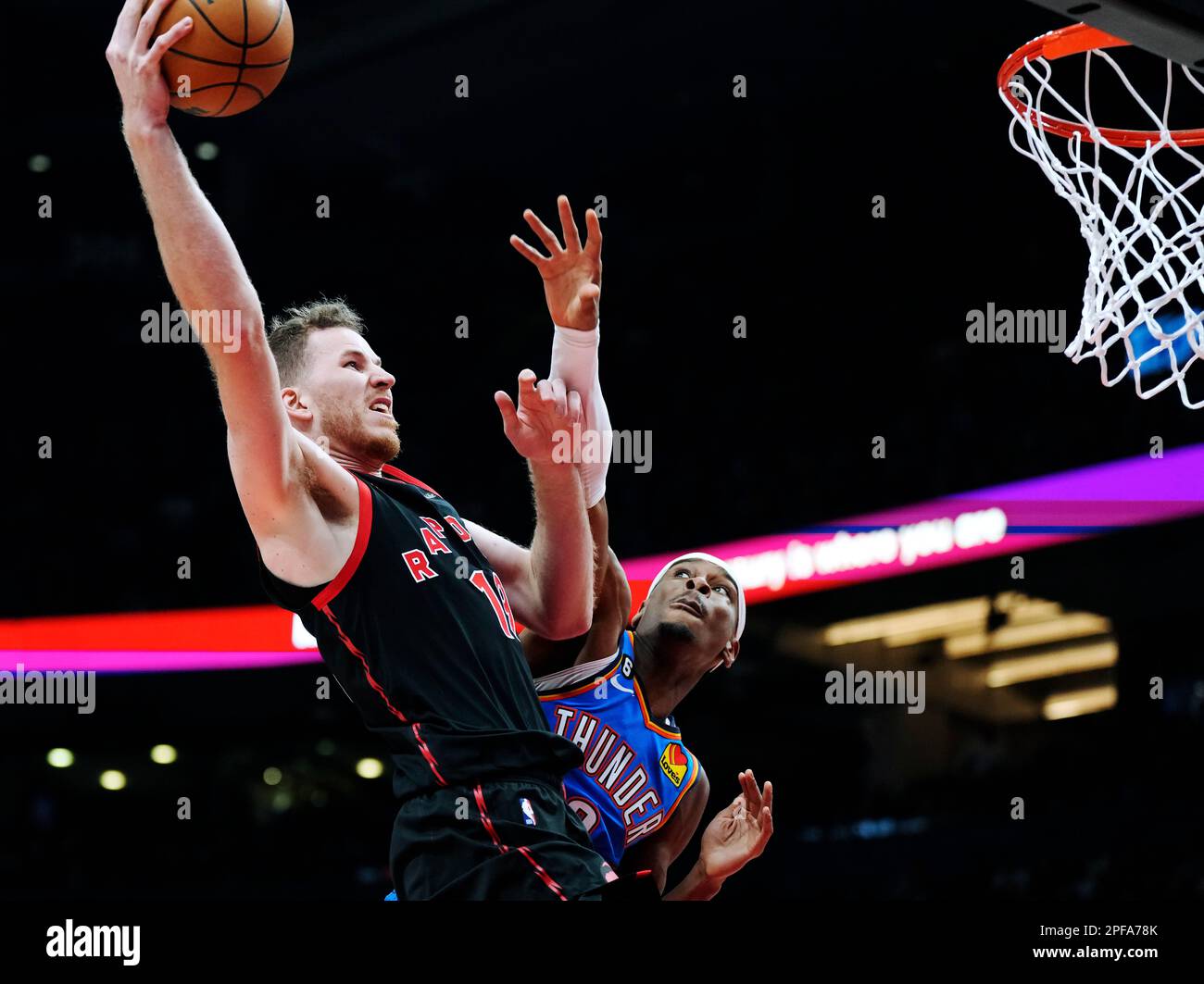 Toronto Raptors center Jakob Poeltl (19) dunks as Oklahoma City Thunder ...
