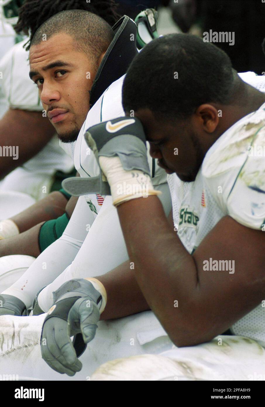 Michigan State's Luc Mullinder, left, and Brandon McKinney, right, sit ...