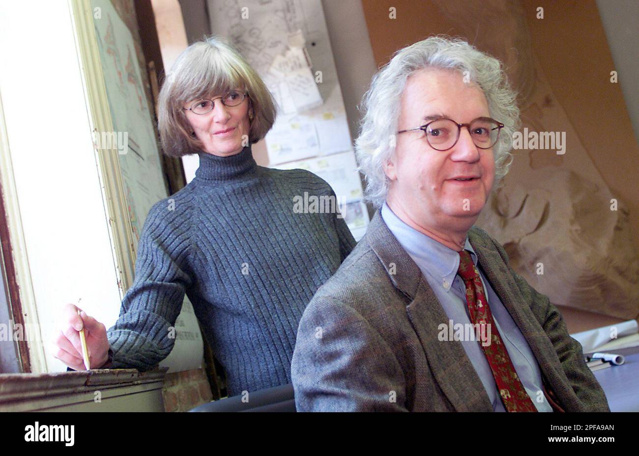Paul Pawlowski, right and his wife, Ingrid, background, are seen in ...