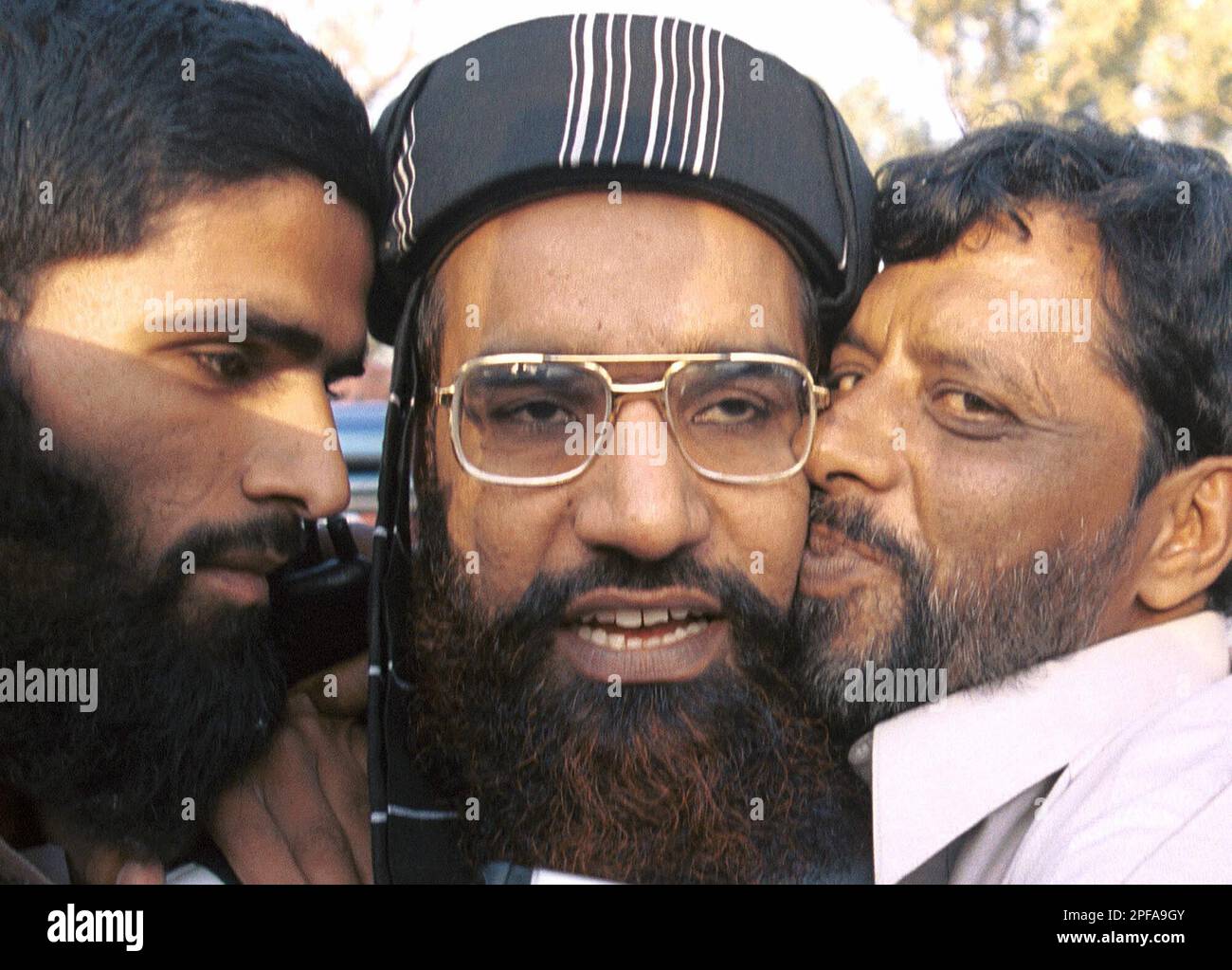 Supporters Maulana Azam Tariq, center, the head of the outlawed pro ...