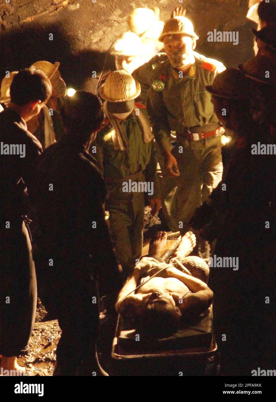 Rescuers retrieve the body of a coal miner who choked to death on ...