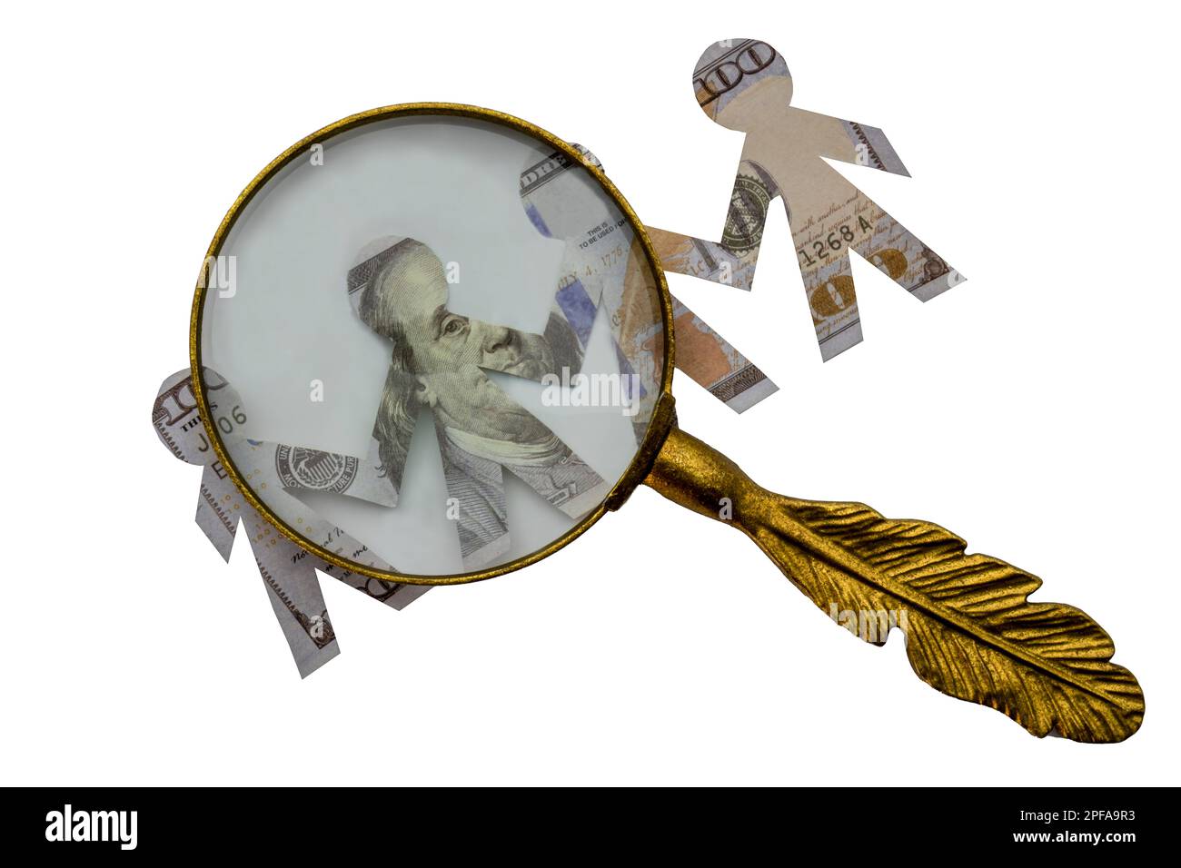 Magnifying glass viewing paper dolls cut out of hundred dollar bills of ...