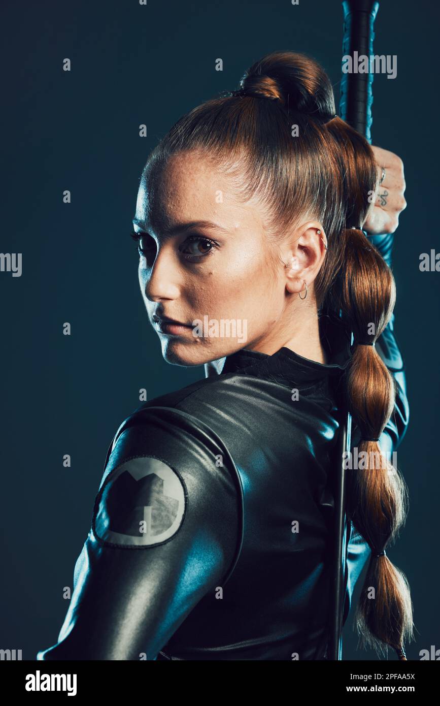 Woman, warrior and vigilante in cosplay with sword ready for battle ...